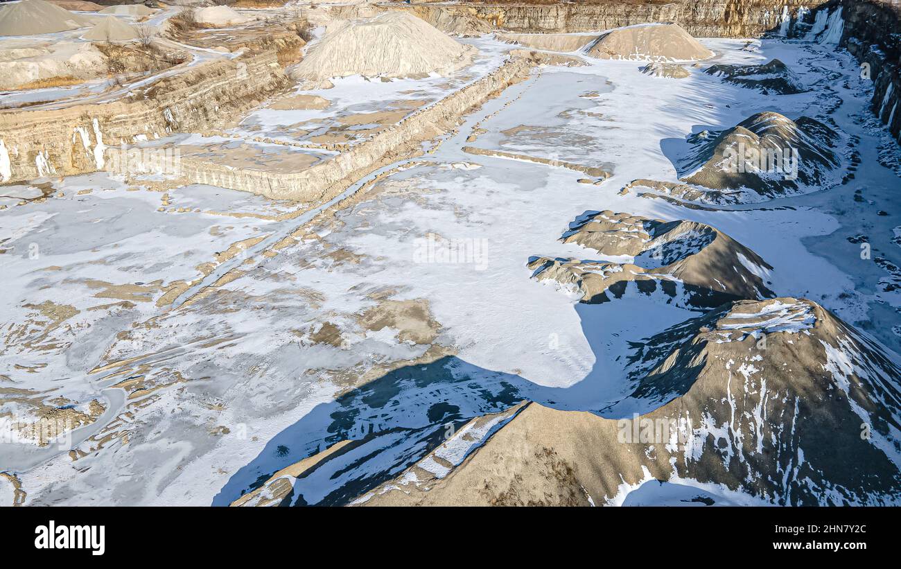 Snow covered rock quarry Stock Photo - Alamy