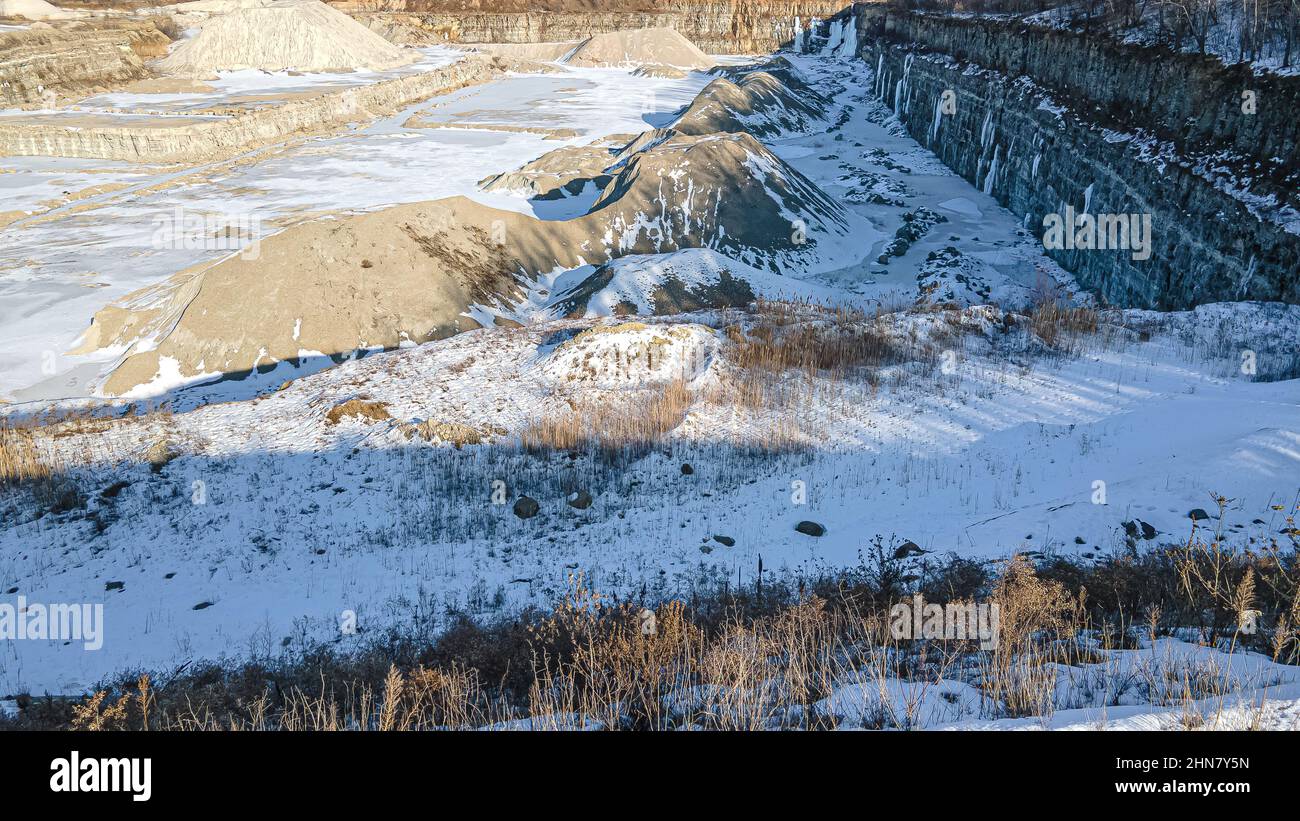 Snow covered rock quarry Stock Photo - Alamy