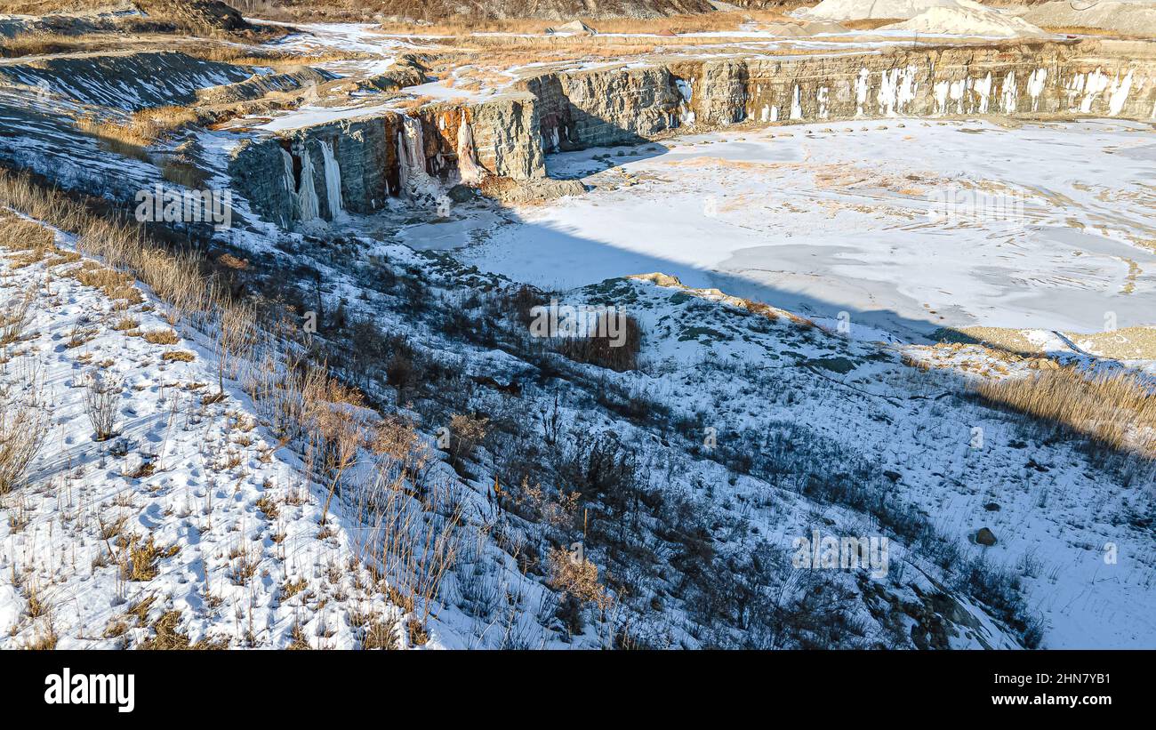 Snow covered rock quarry Stock Photo - Alamy