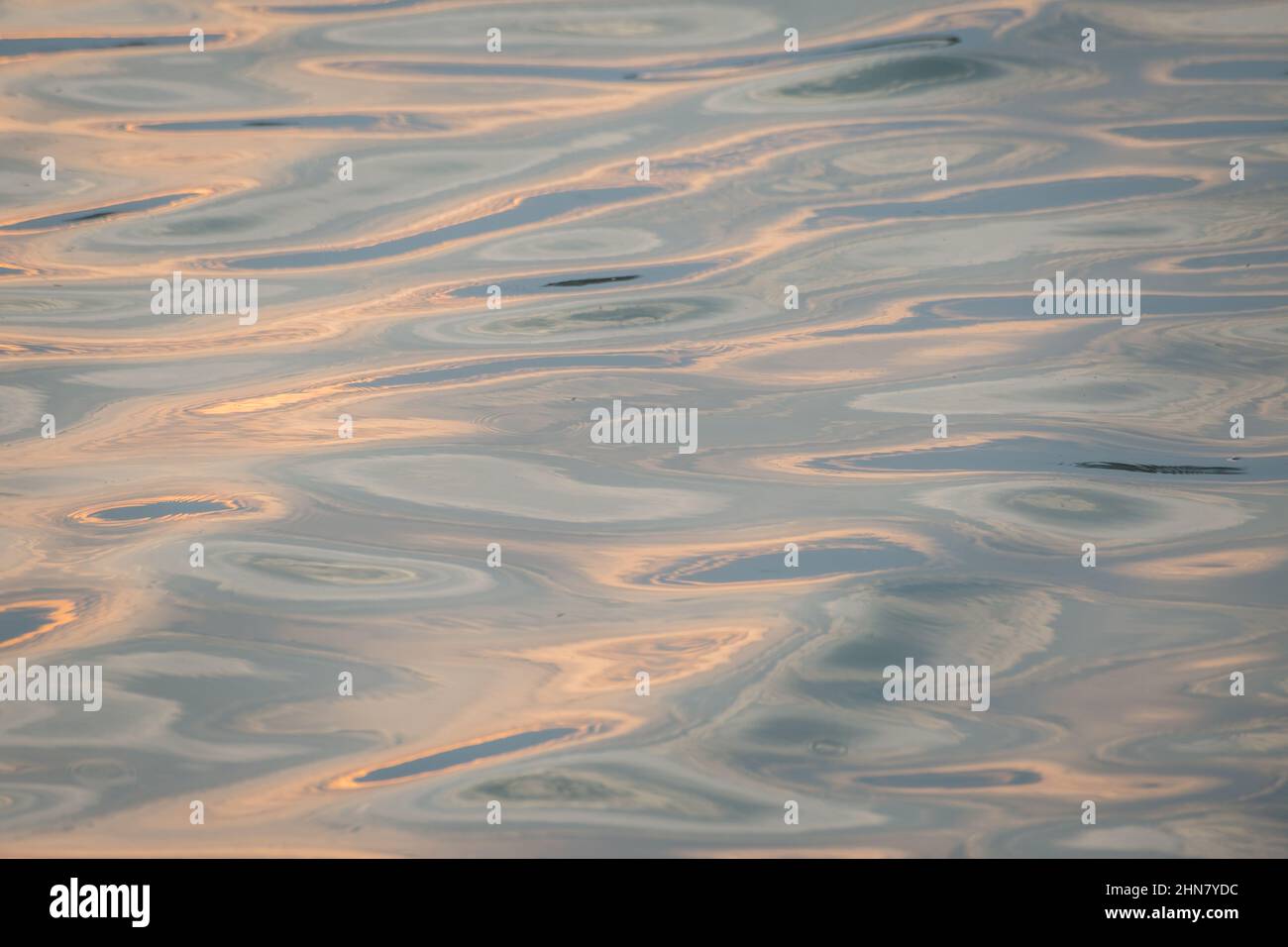 beautiful water wave pattern sunset and reflections background Stock ...