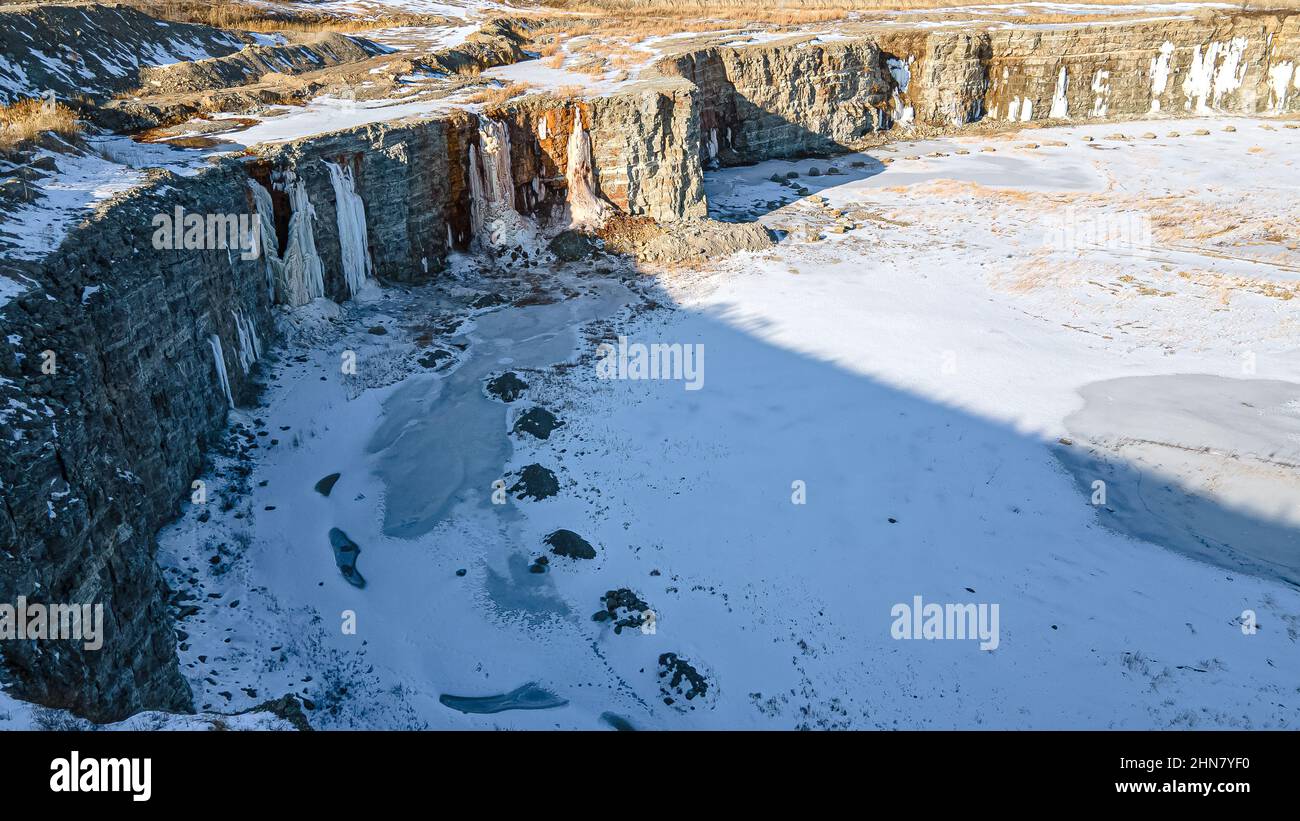 Snow covers this empty rock quarry with no human activity this season ...