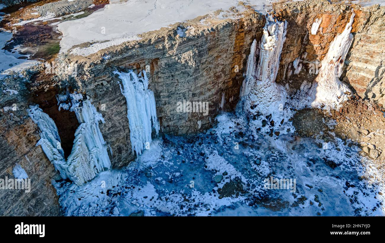Snow covered rock quarry Stock Photo - Alamy