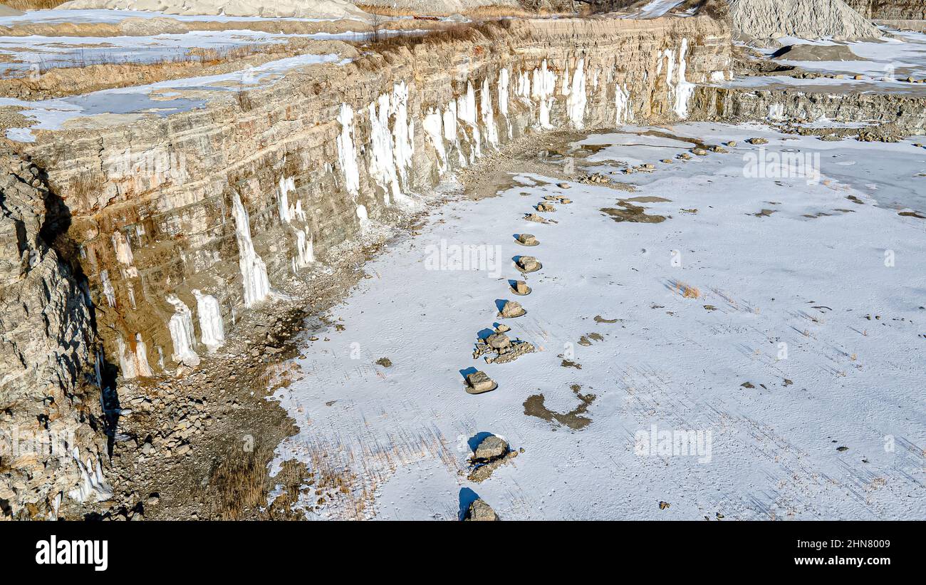 Snow covered rock quarry Stock Photo - Alamy