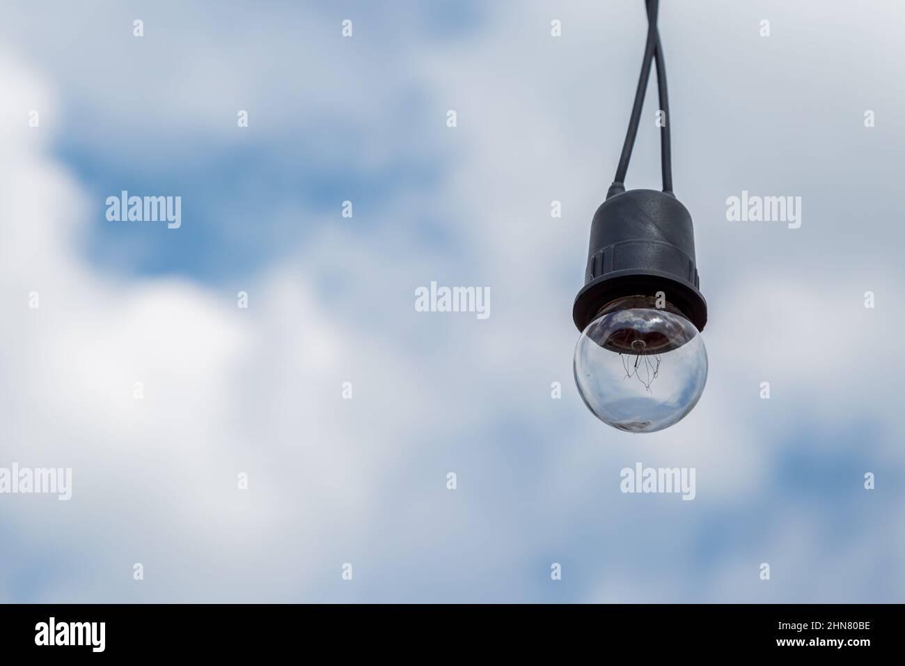 Light Bulb and sky background Stock Photo - Alamy