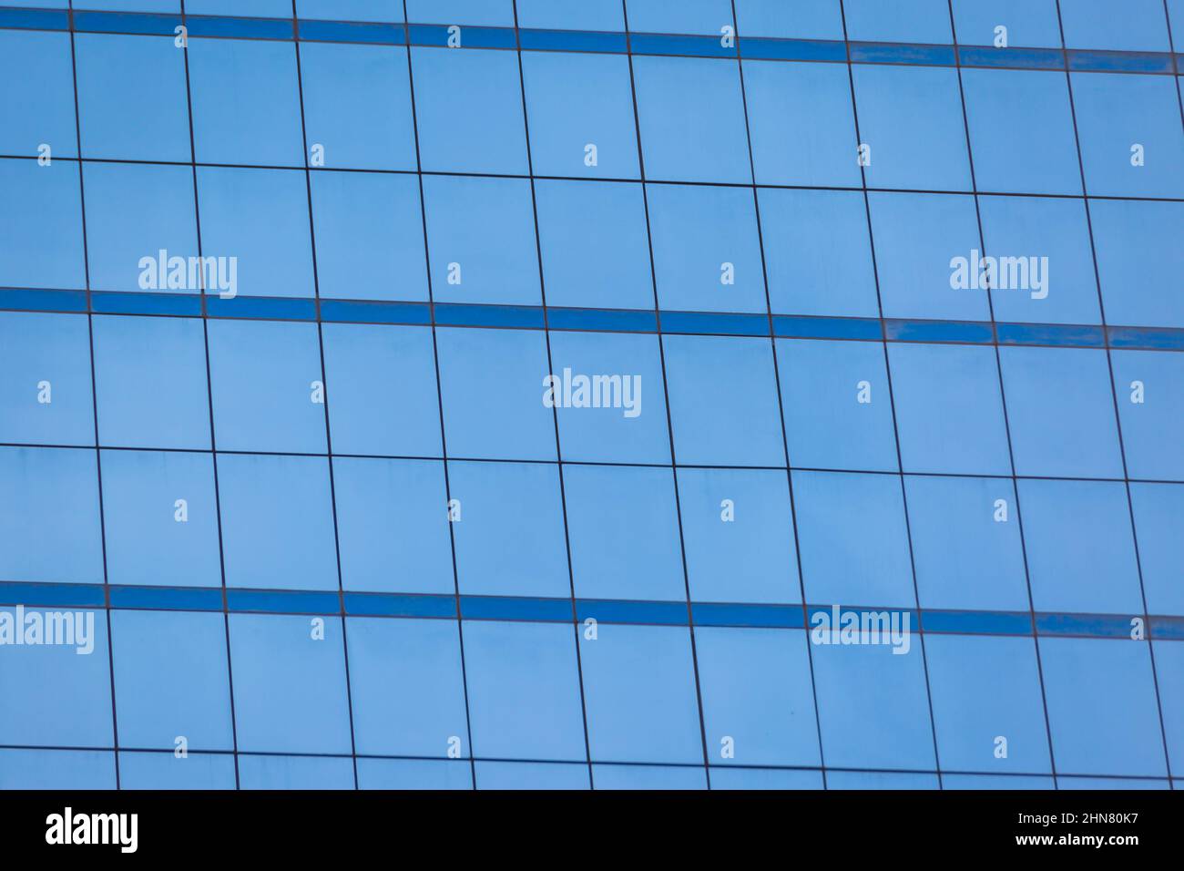 Blue glass windows of office building for background Stock Photo - Alamy