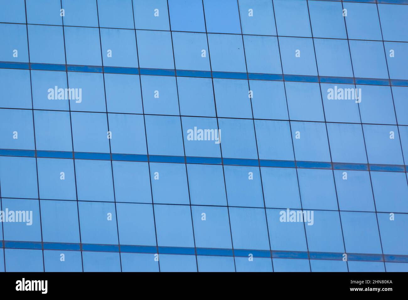 Blue glass windows of office building for background Stock Photo - Alamy