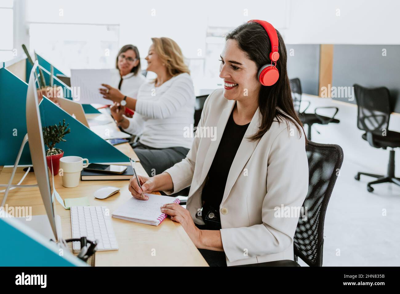 latin business adult woman working with computer at the office in ...