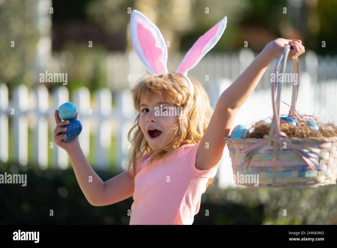 Easter egg hunt. Excited child with easter basket. Child hunting easter ...
