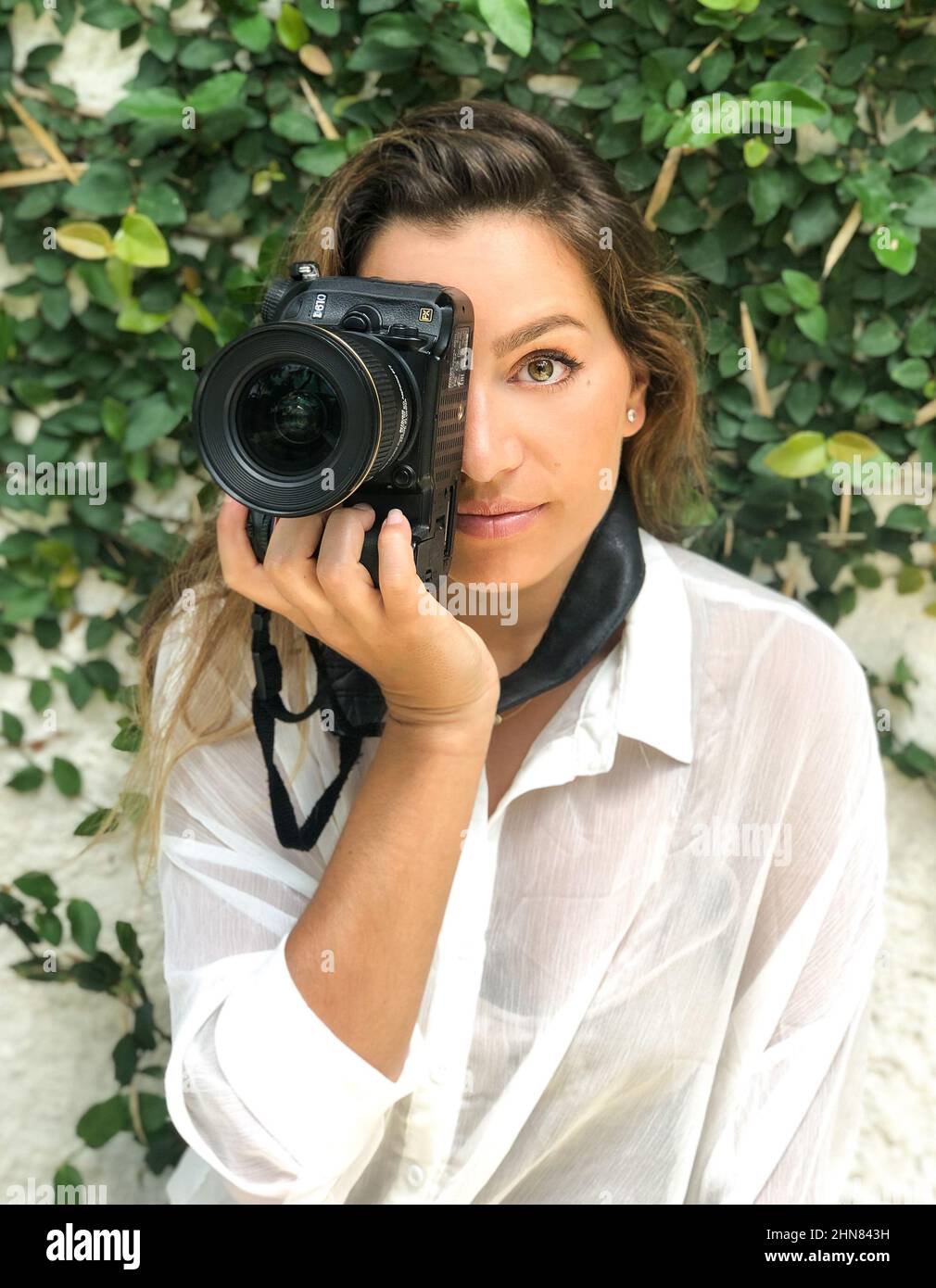 Closeup shot of Caucasian girl with camera in Laura San Fillipo, United ...