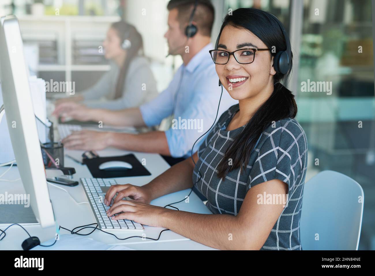 Resolving client issues with confidence. Portrait of a happy and ...