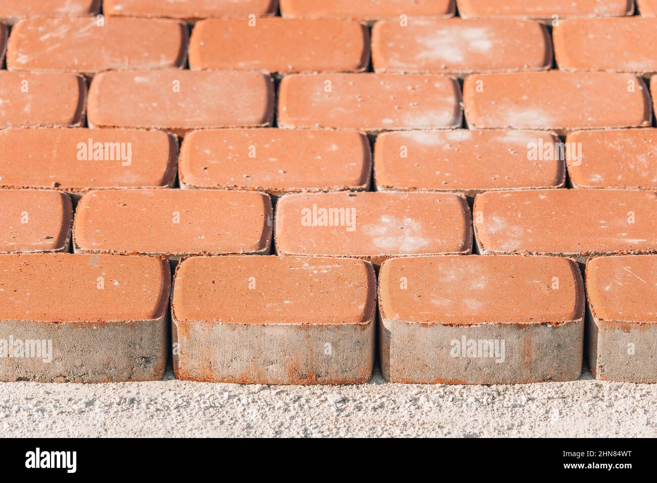 Brown concrete permeable flooring assembled on a substrate of sand ...