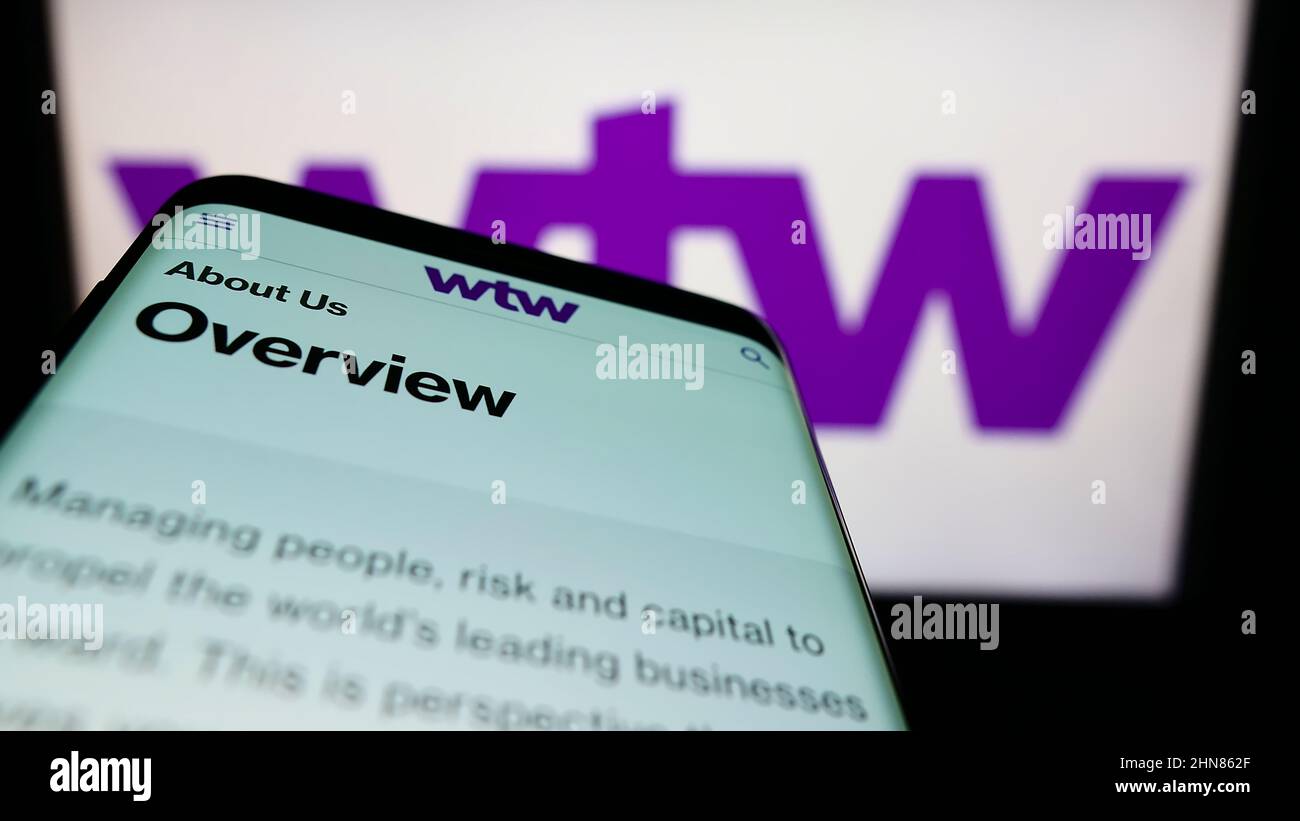Mobile phone with webpage of financial company Willis Towers Watson plc ...