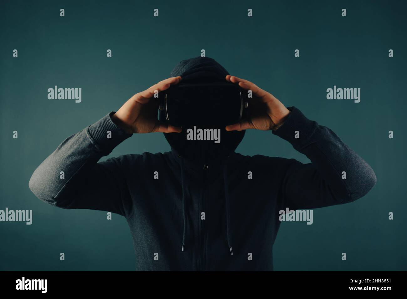 Metaverse digital cyber world technology. Man with VR glasses playing ...