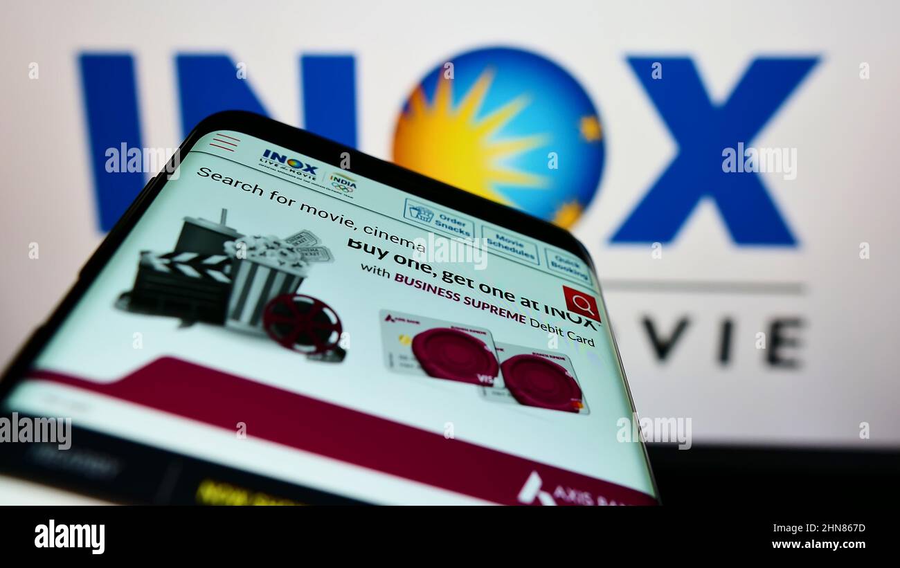 Mobile phone with webpage of Indian cinema company INOX Leisure Limited ...