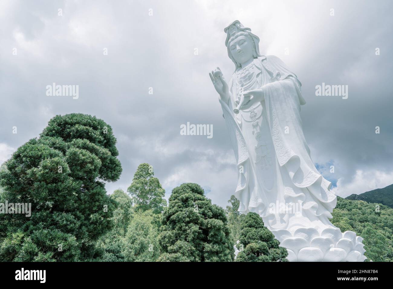 Low angle shot of the historic white Ofuna Kannon-ji statue in the ...