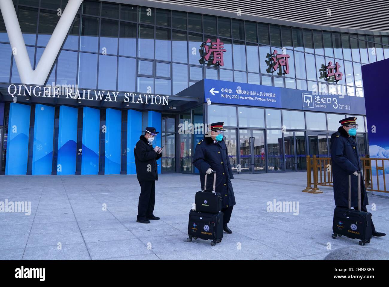 Train staff outside Qinghe railway station in Beijing during day eleven ...