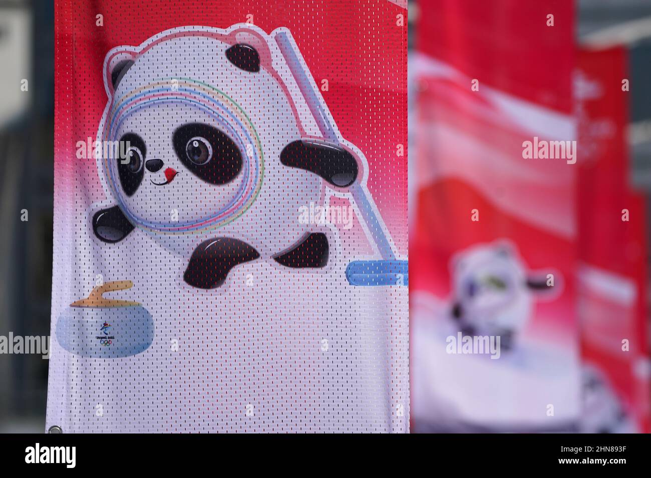 A banner of the games mascot Bing Dwen Dwen during day eleven of the ...
