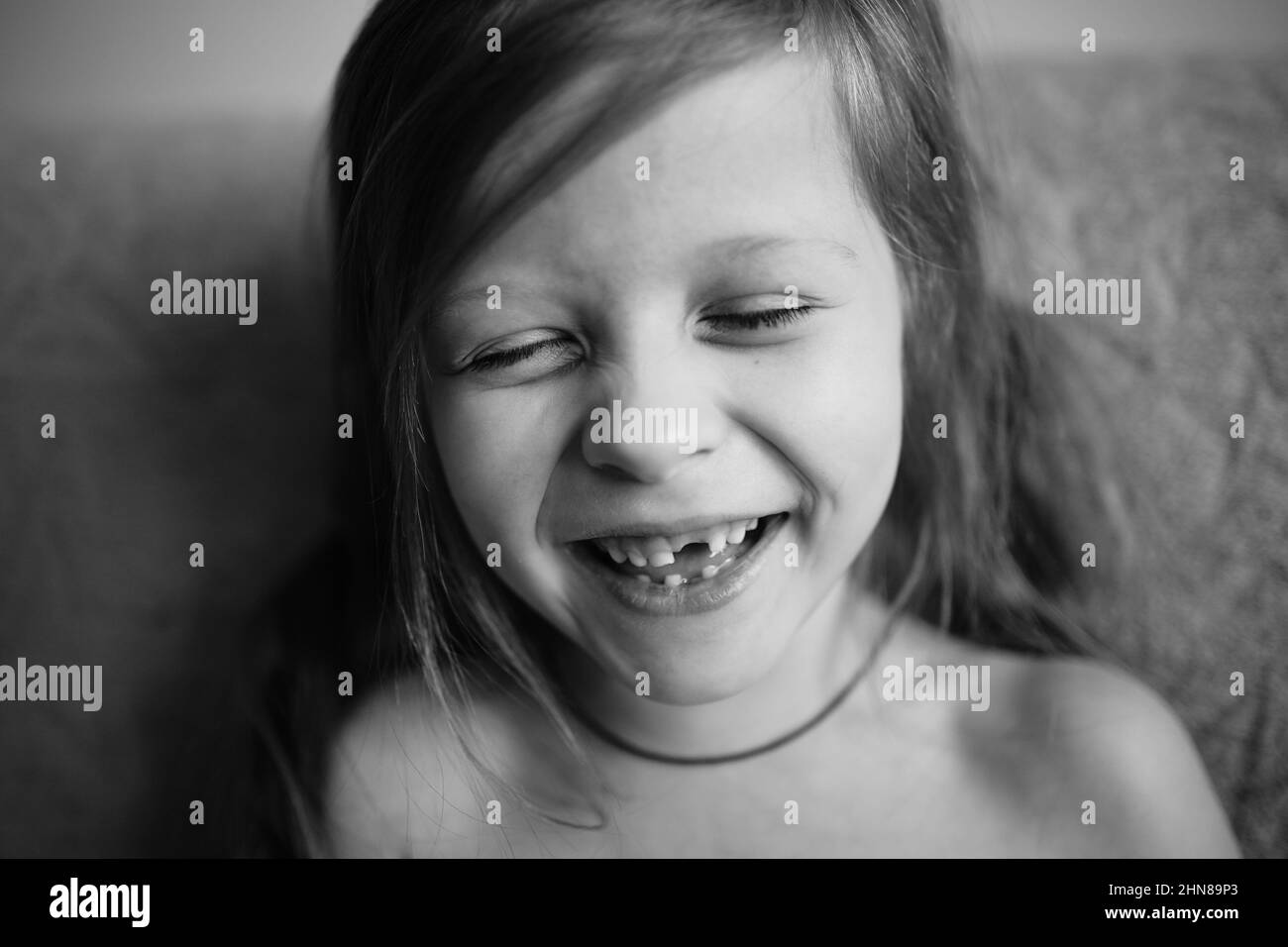 cheerful girl without front teeth Stock Photo - Alamy