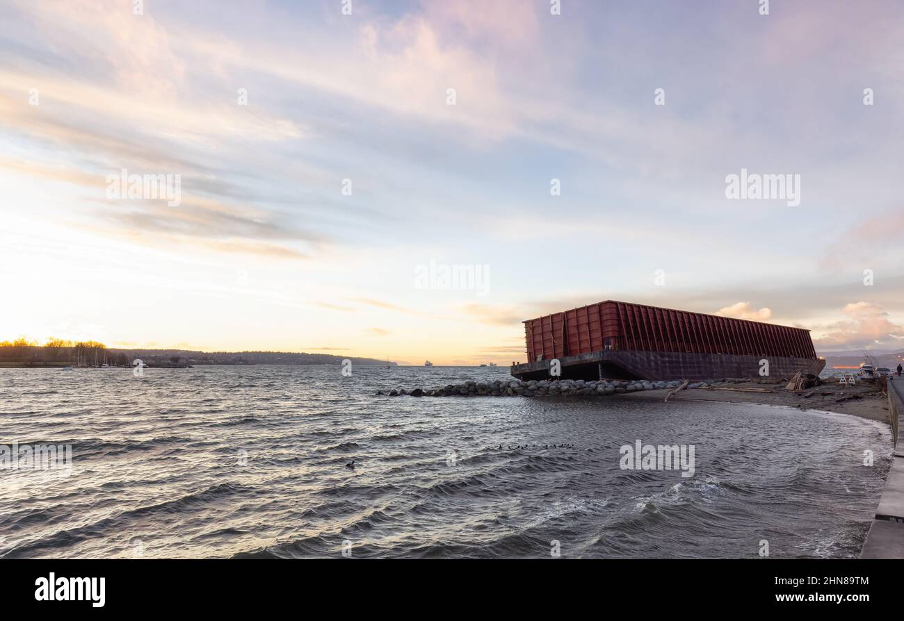 Barge container ship collided on a rocky coast during wind storm Stock ...