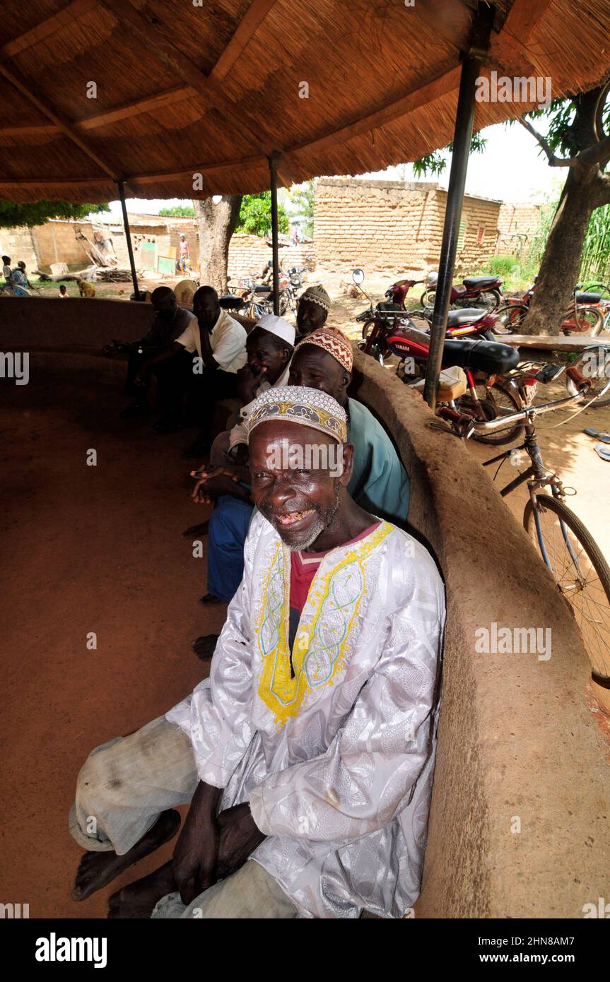 Elderly Mossi men socializing in their village in central Burkina Faso ...