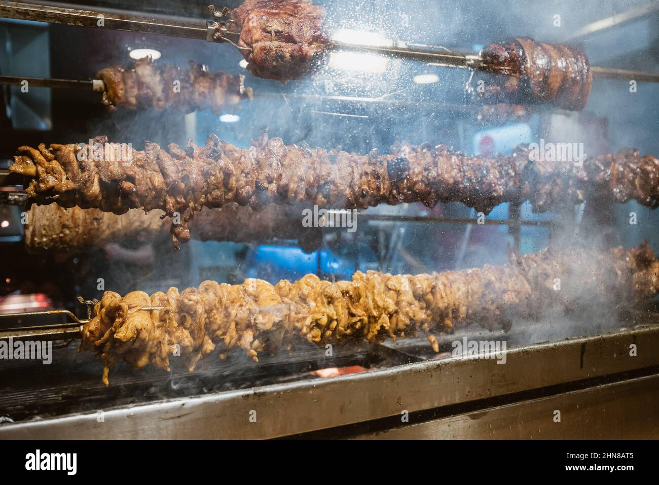 Lamb spinning on spit cooking hi-res stock photography and images - Alamy