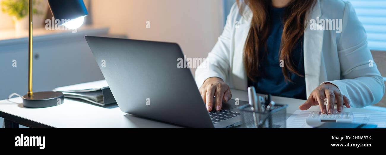 Overwork Concept The female working in the office and typing something ...