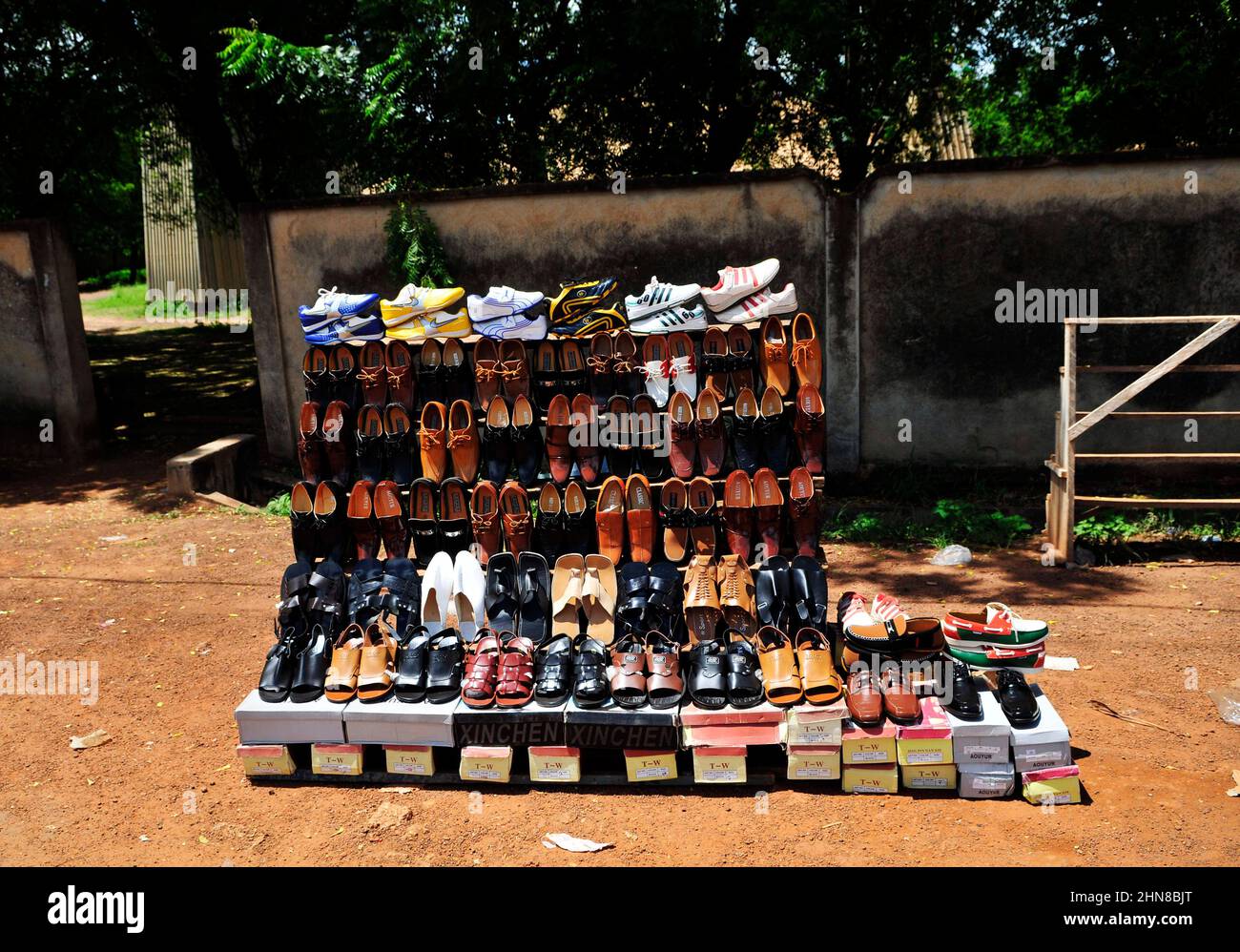 A roadside shoe stall along the road to Benin in South Eastern Burkina ...