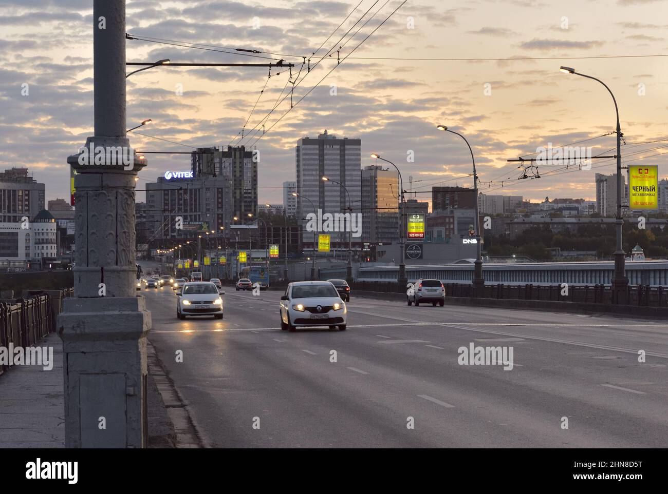 Novosibirsk, Siberia, Russia - 10.10.2019: Cars with headlights on go ...