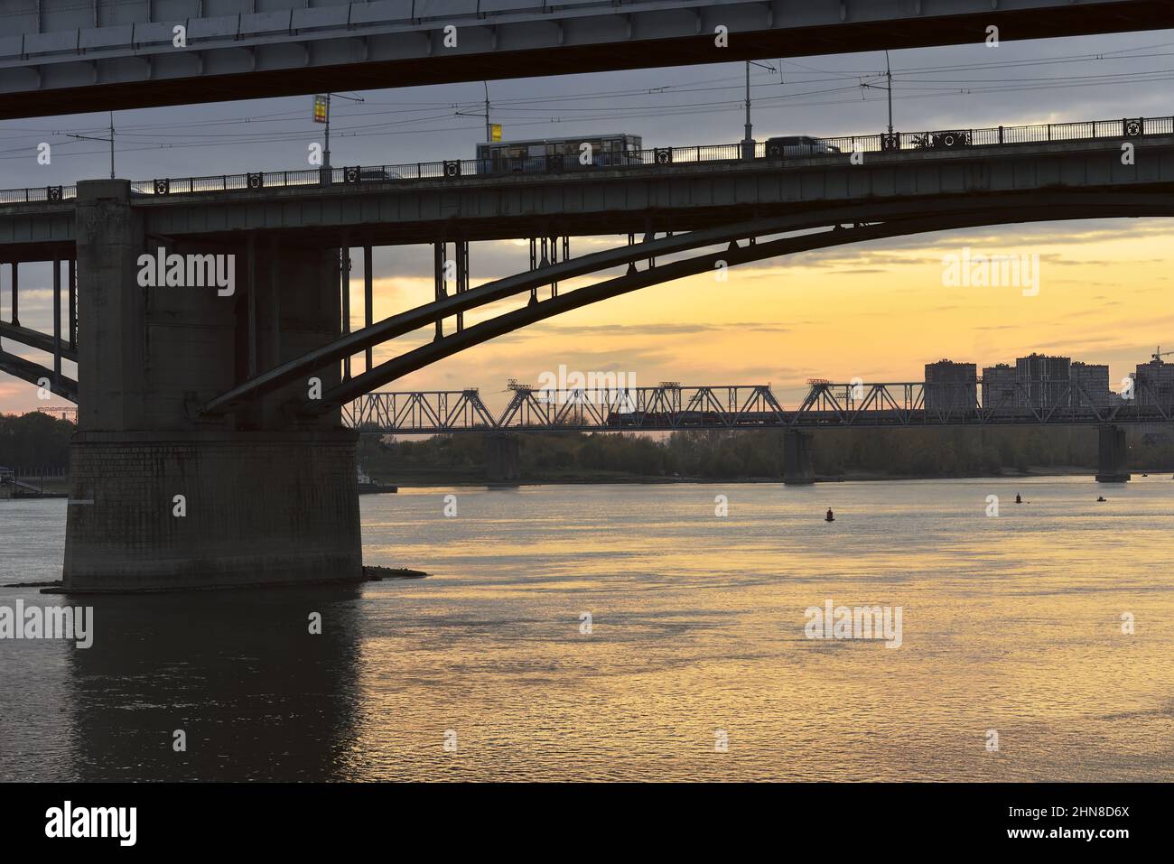 Arched road bridge, railway bridge over the Ob river in the capital of ...