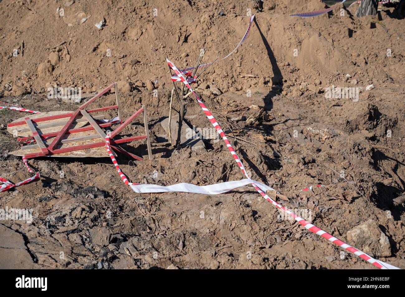 Fallen wooden fence and barrier tape. Fence with prohibition and ...