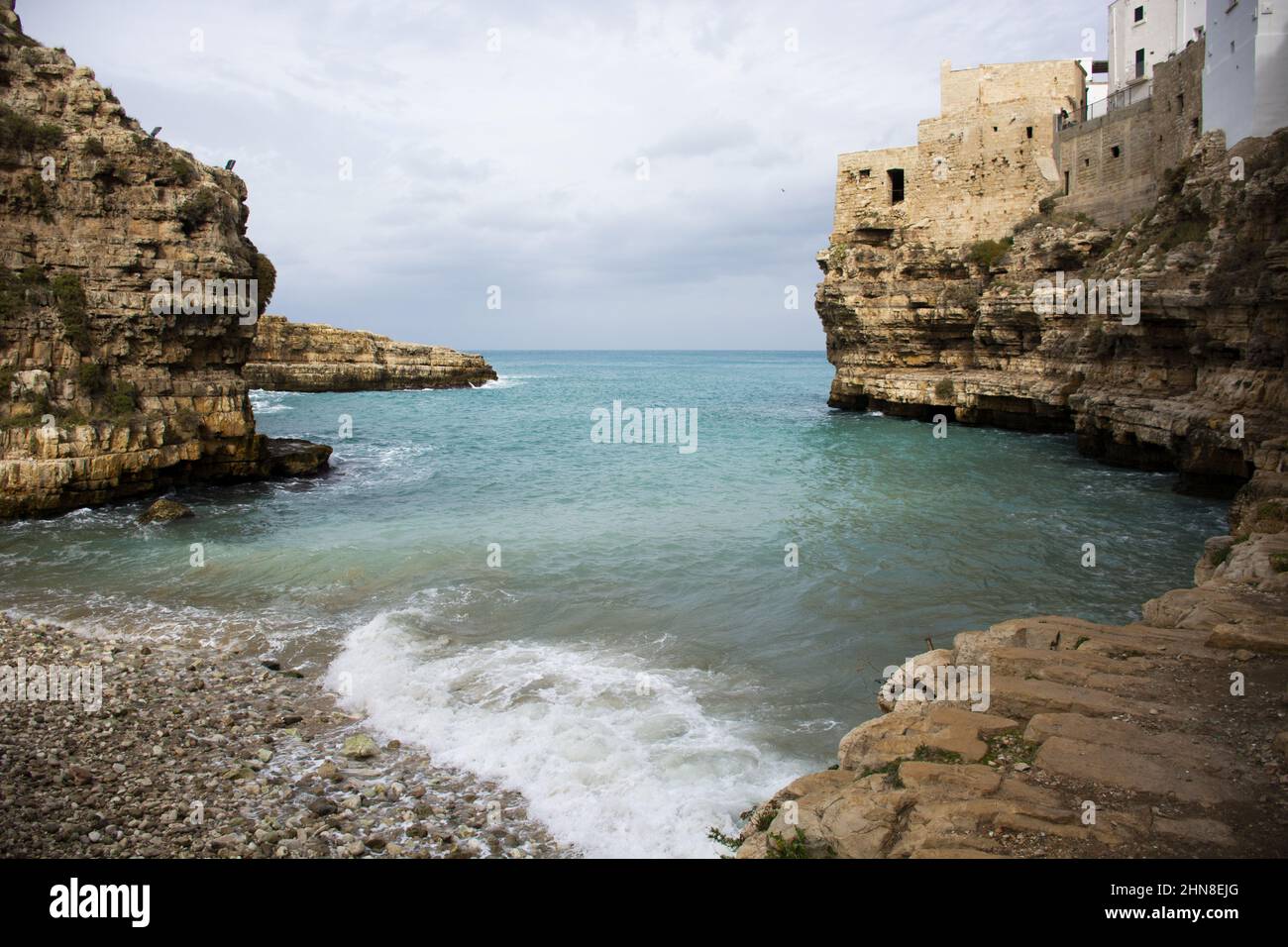 Old buildings on the shore. Lama Monachile, Polignano a Mare, Italy ...