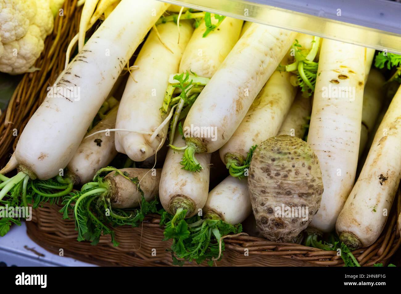 White radish in boxes on counter Stock Photo - Alamy