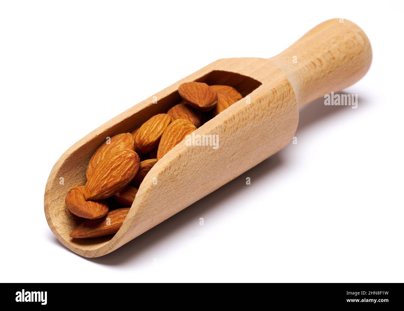 Wooden Scoop full of Almond nuts isolated on a white background Stock ...