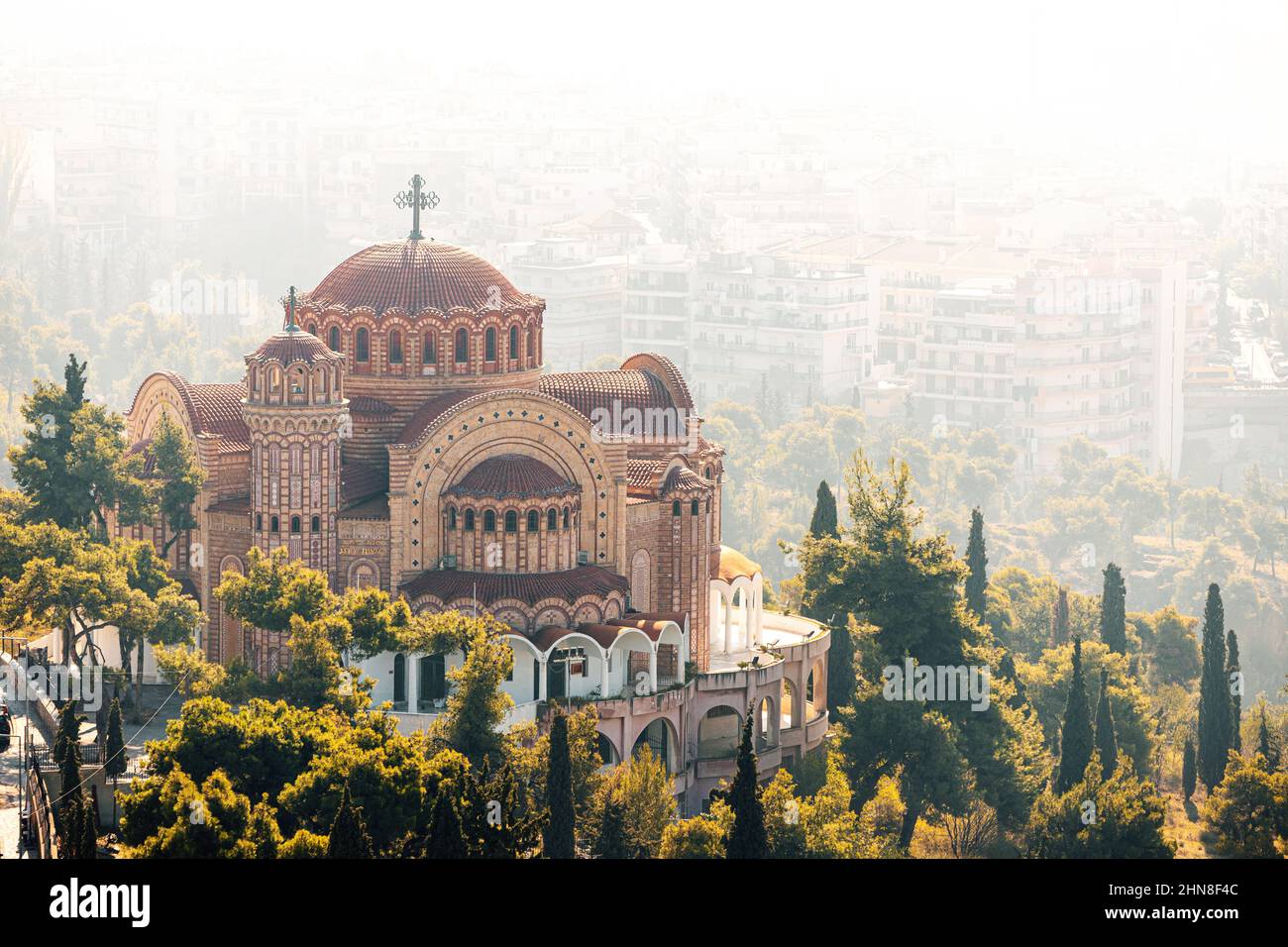 View of Greek Church of Saint Pavlos flying in the morning haze. Thessaloniki religious and ...