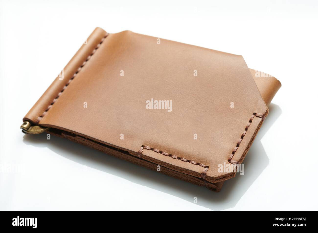 Genuine leather closed card wallet isolated on white studio background ...