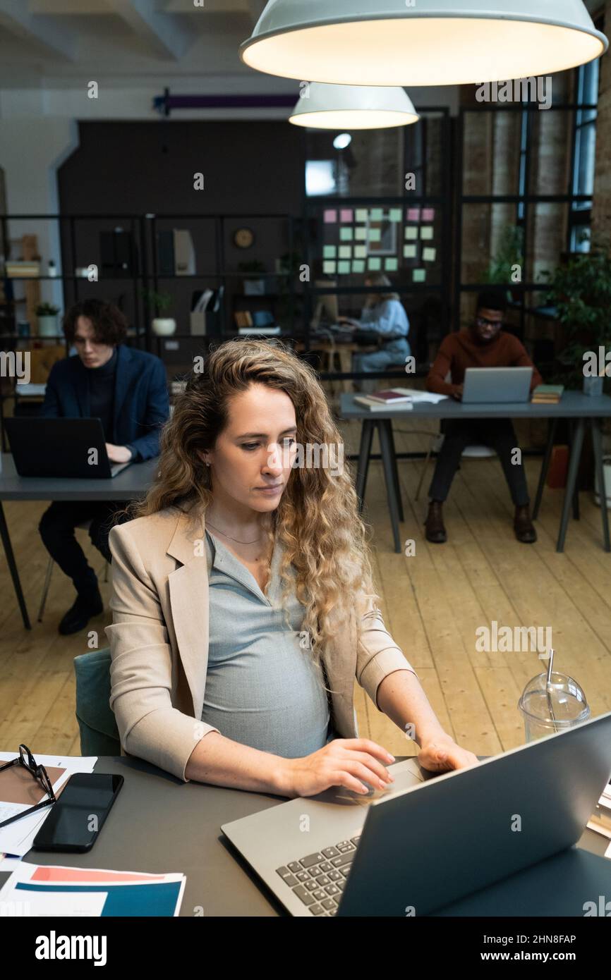 Pregnant woman working secretary in hi-res stock photography and images ...