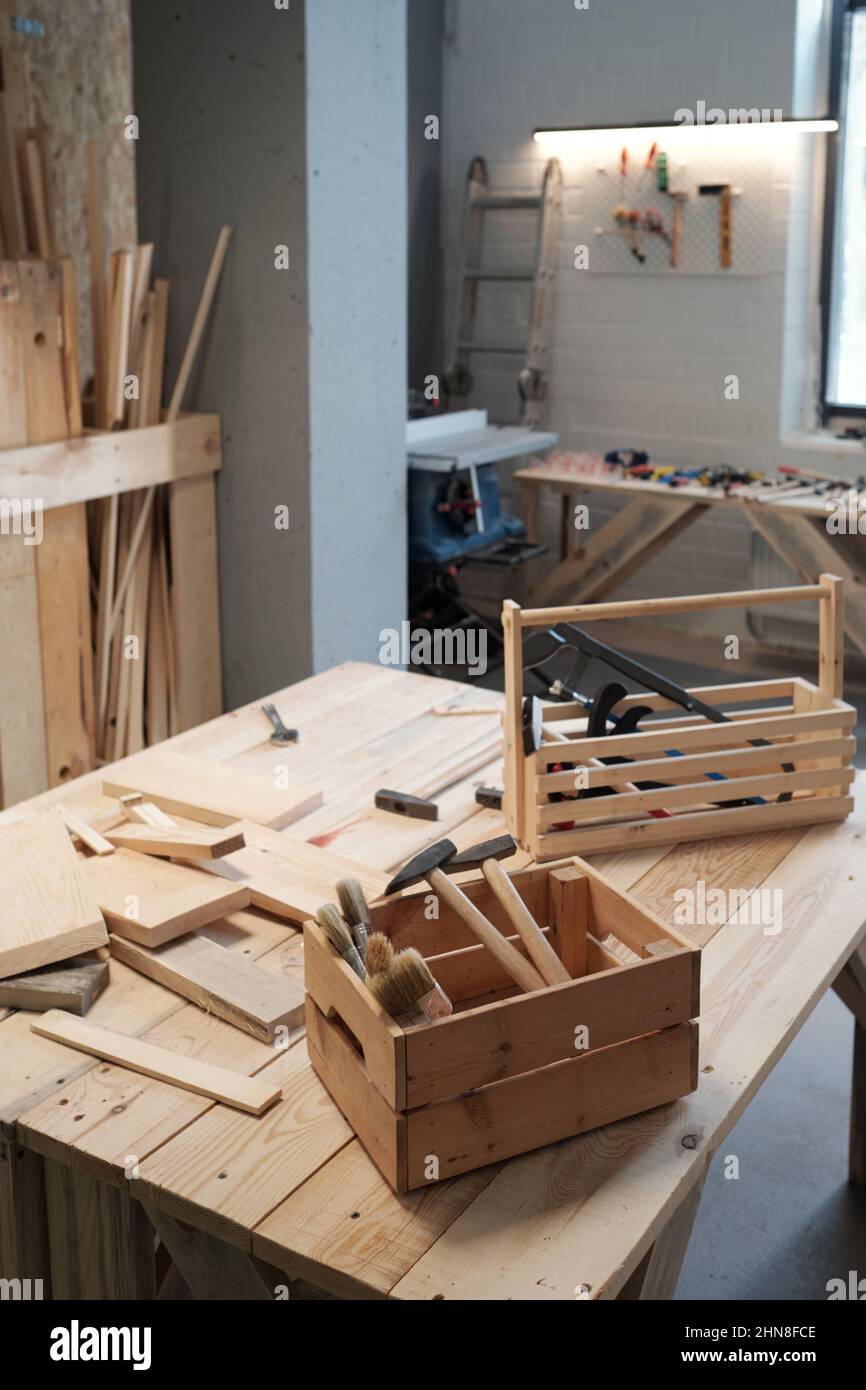 Vertical background image of toolboxes on table in woodworking workshop ...