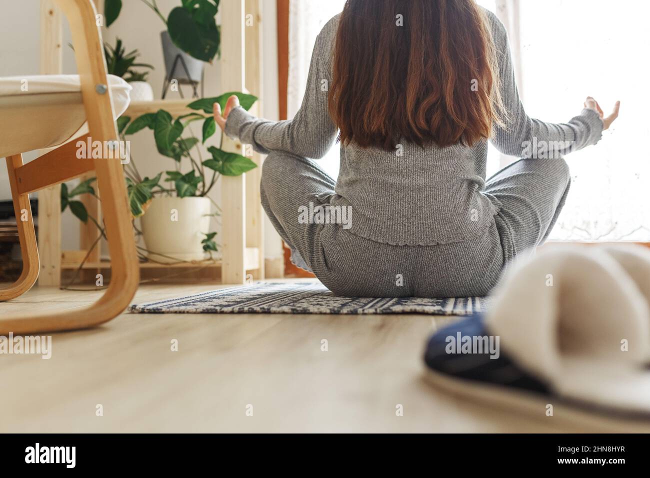 Young female sitting cross-legged in Easy pose, Sukhasana posture and ...