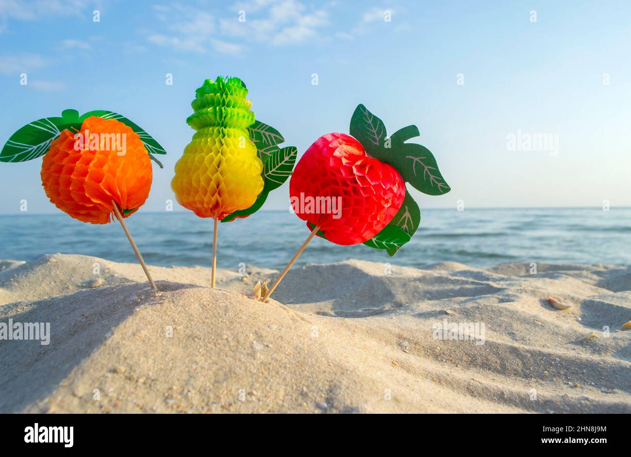Bright Figure Colored Paper Decorations for Cocktail on Sandy Sea Beach ...