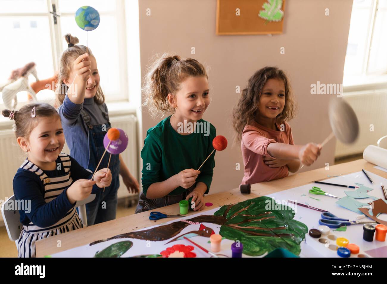Group of little kids working on project during creative art and craft ...