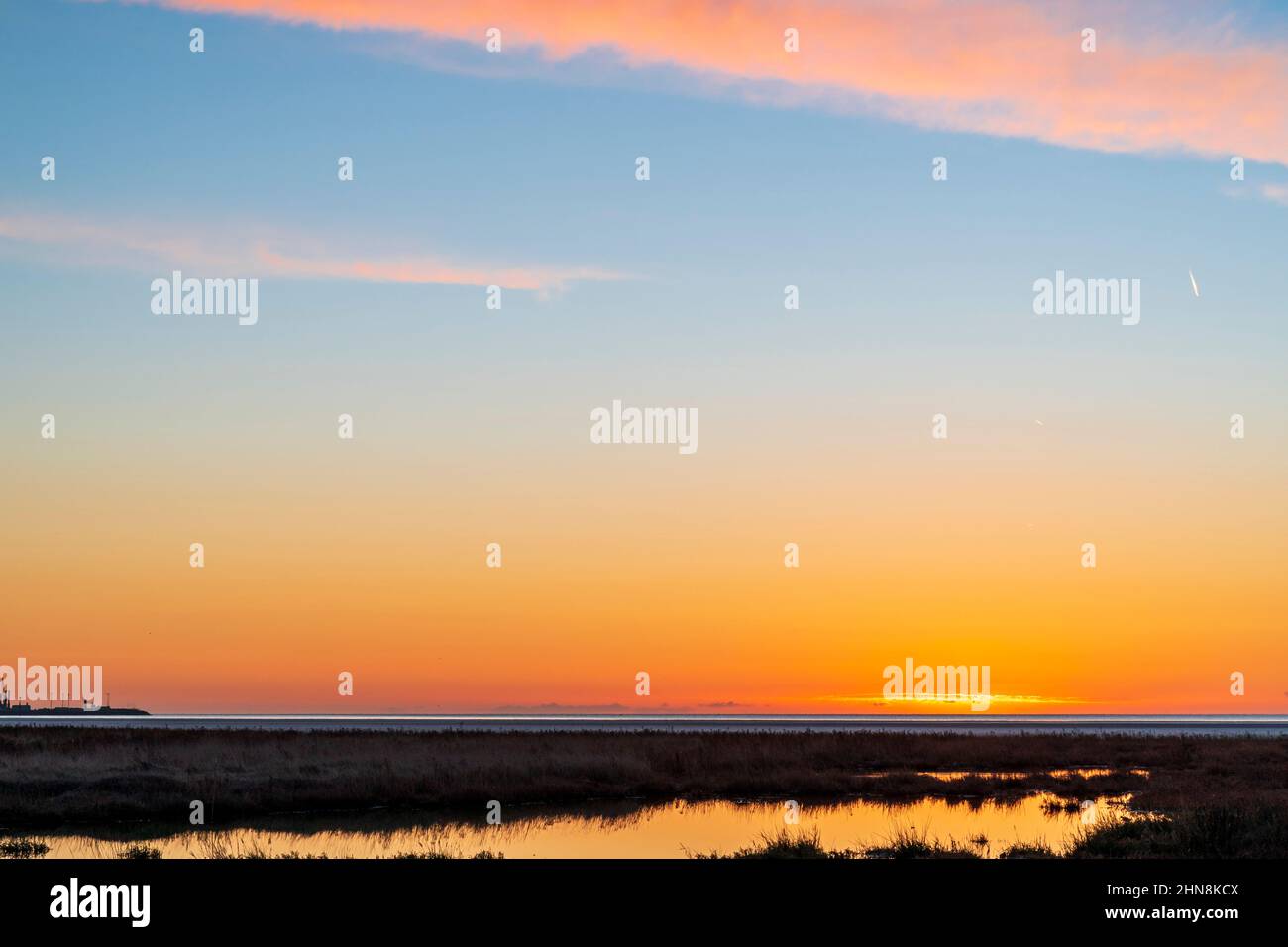 The dawn sky over the sea, English Channel, in the distance, with the ...