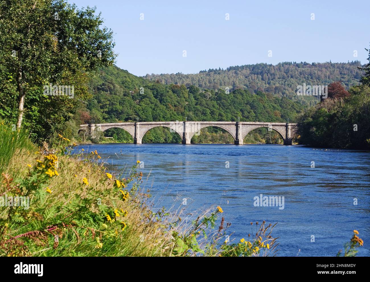 The old arched bridge over the River Tay at Dunkeld, Perthshire ...