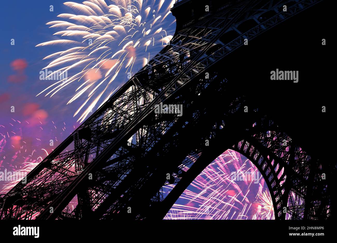 Celebratory colorful fireworks over the Eiffel Tower in Paris, France ...