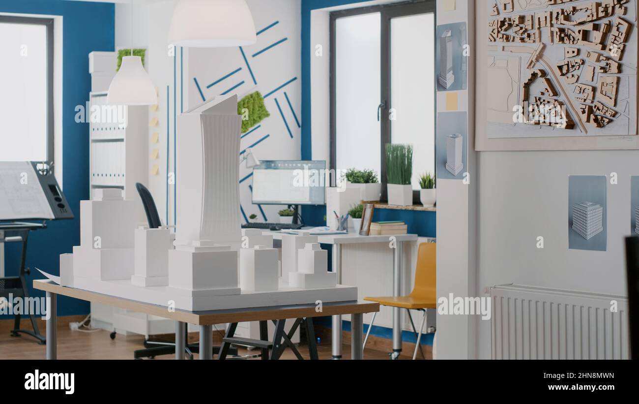 Empty office with building model and tools to design construction ...