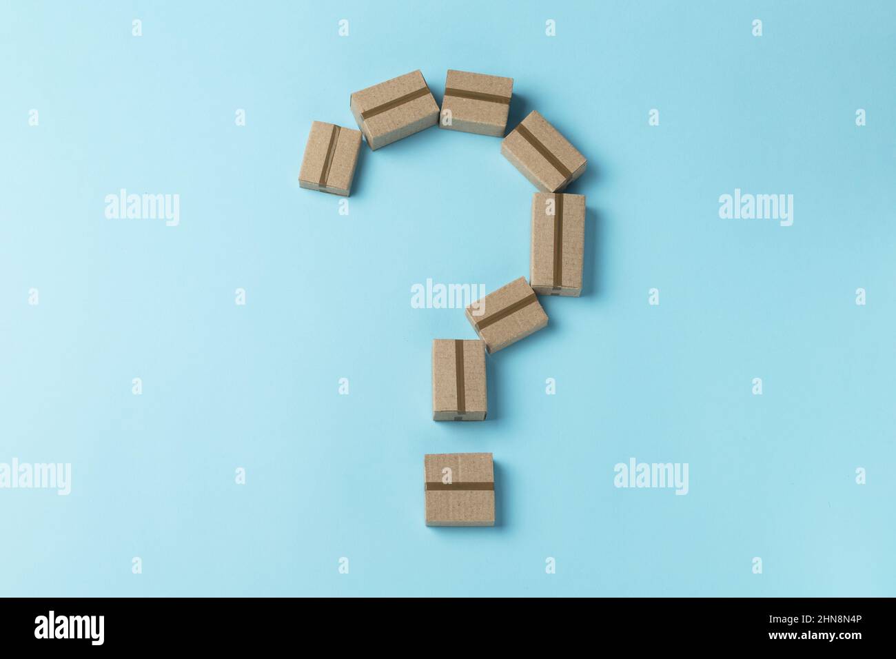 Question mark made from cardboard boxes on a blue background Stock ...