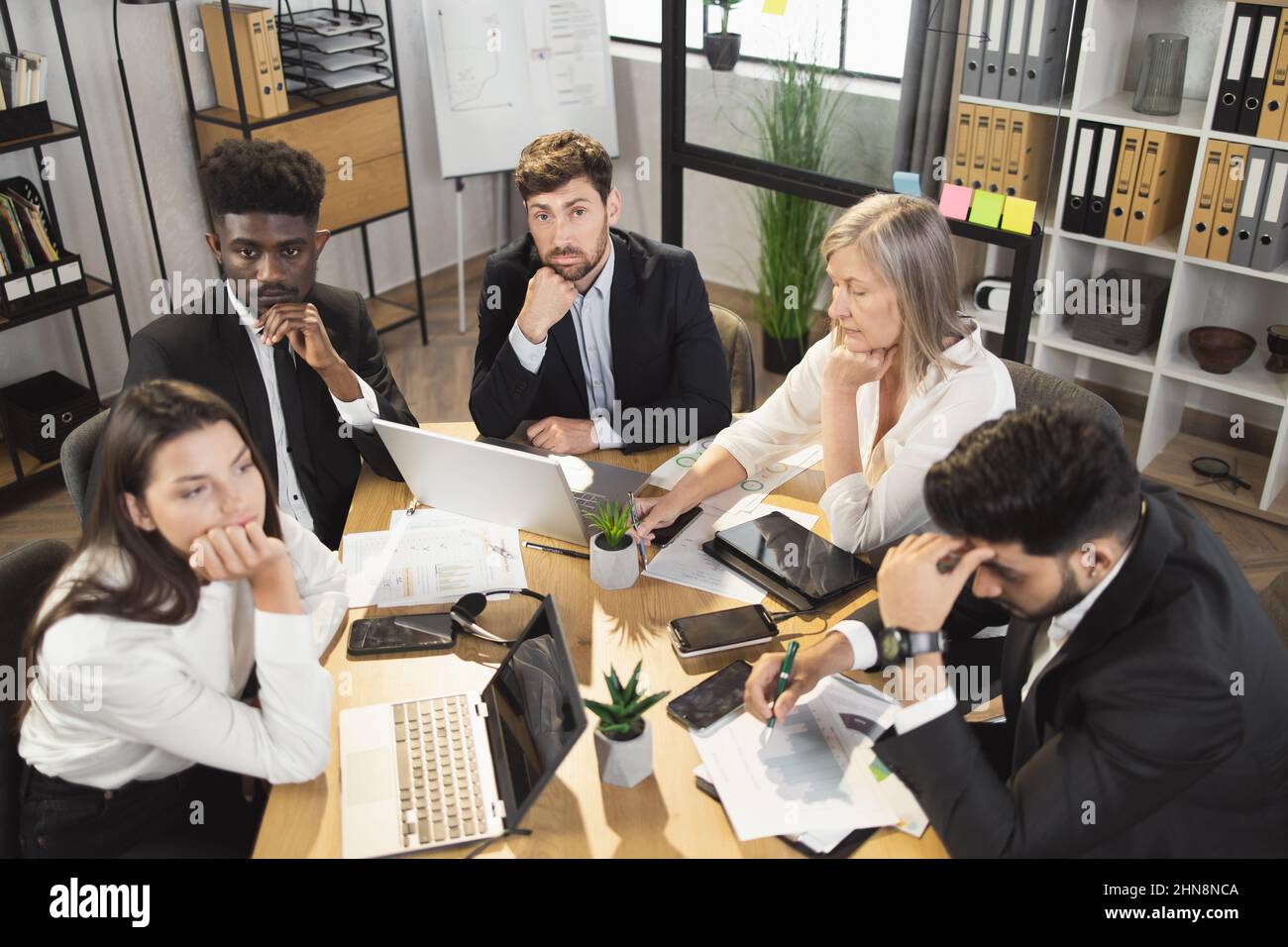 Team of multicultural business people with thoughtful facial expression ...