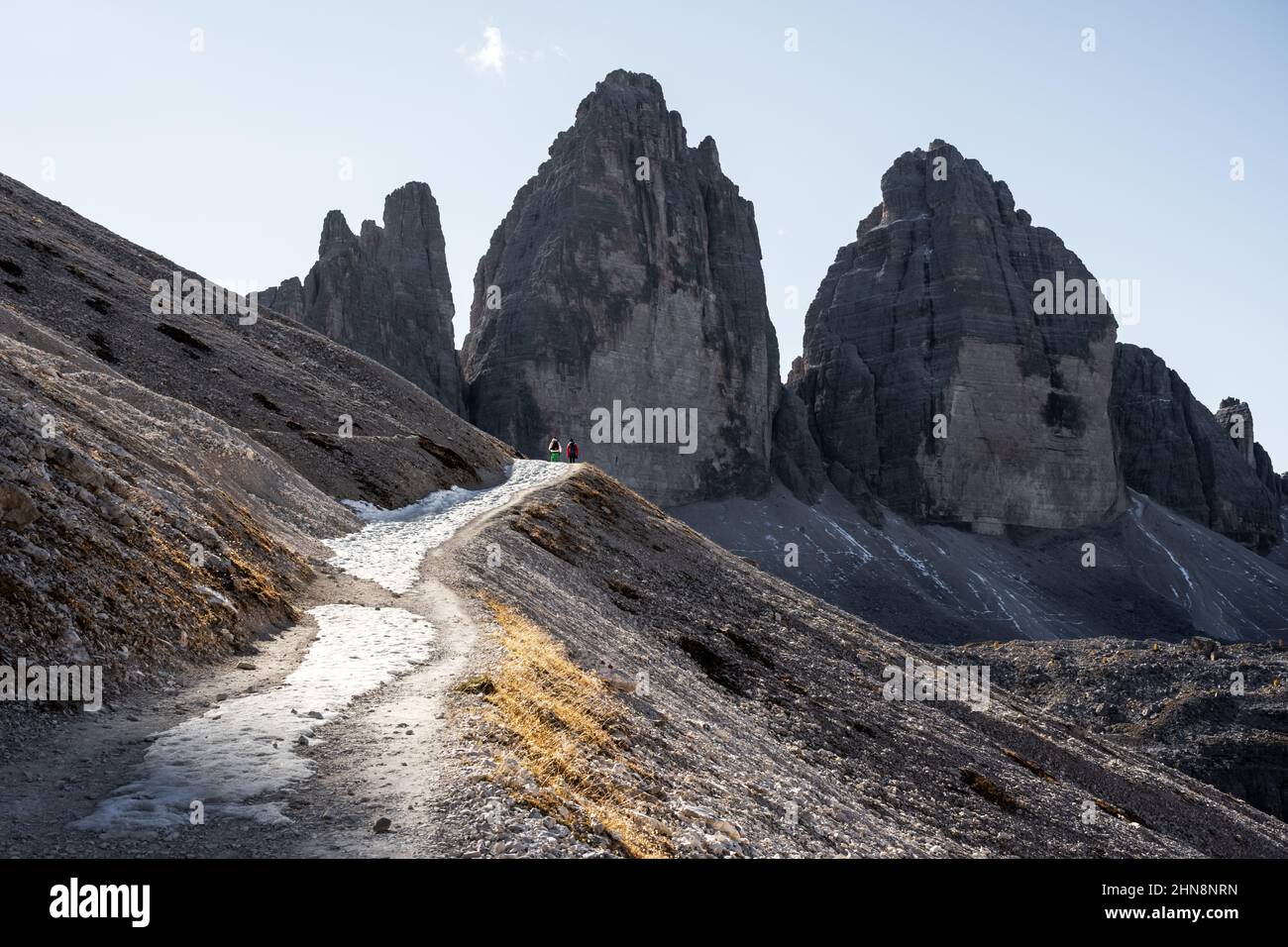 Tourists on the trail on Three Peaks of Lavaredo on autumn time ...