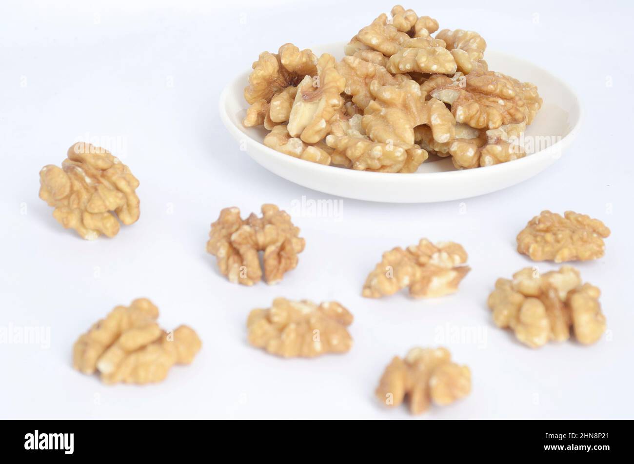 walnut peanuts, in white background Stock Photo - Alamy