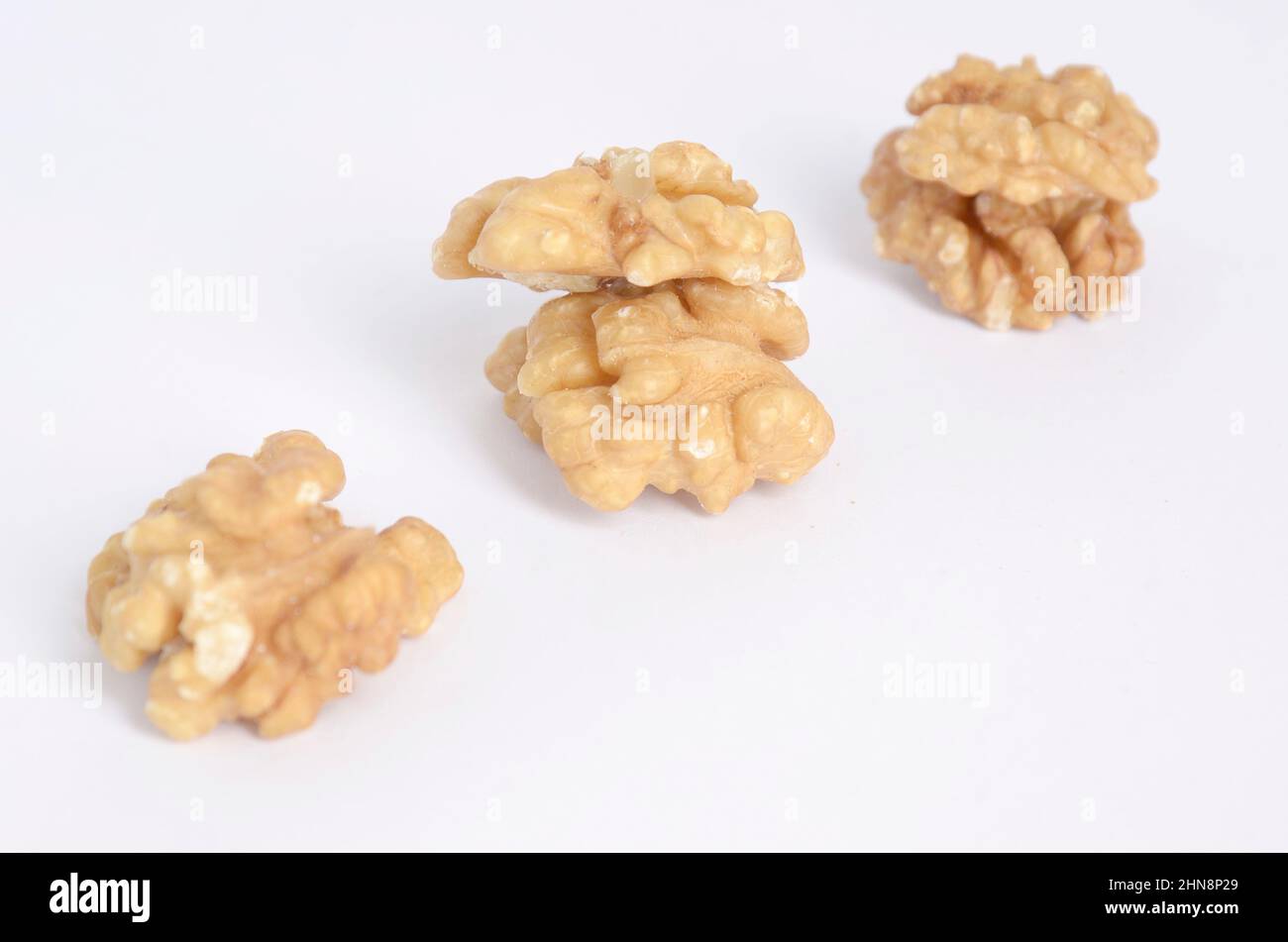 walnut peanuts, in white background Stock Photo - Alamy