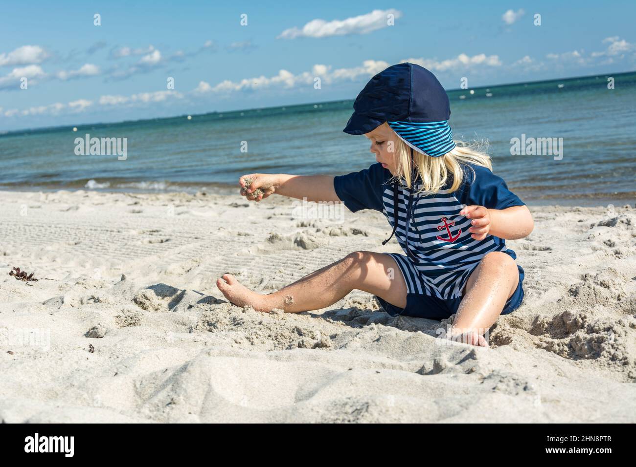 Child playing at beach hi-res stock photography and images - Alamy